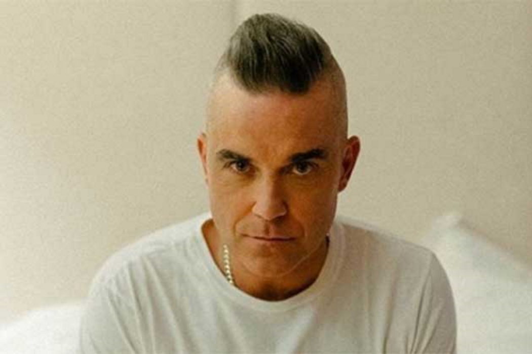 Robbie Williams desiste de lutar contra a calvície - OFuxico